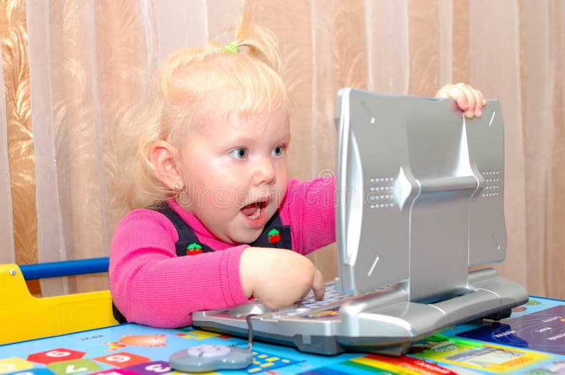 Little Girl with Child S Computer (notebook). Stock Image - Image of ...