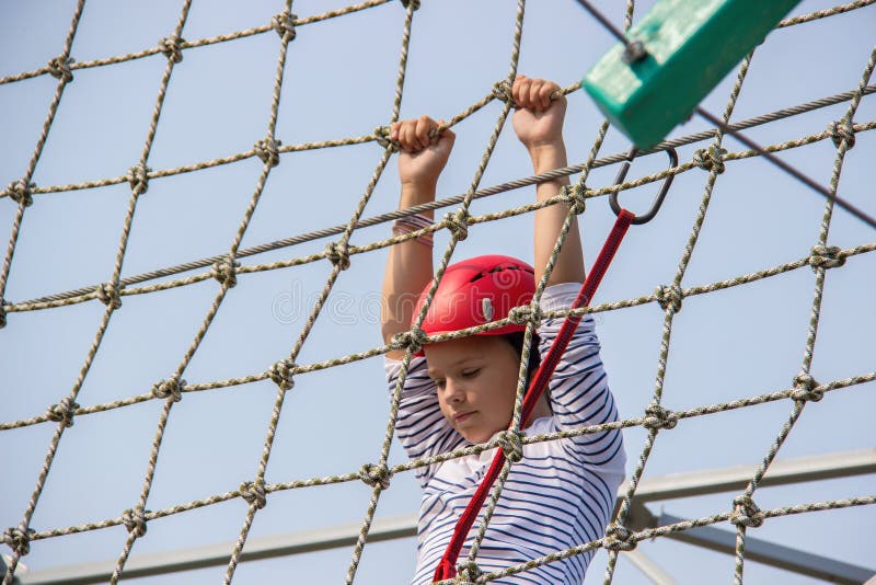 Little Girl Climbing on an Outdoor Ropes Course. Stock Image - Image of ...