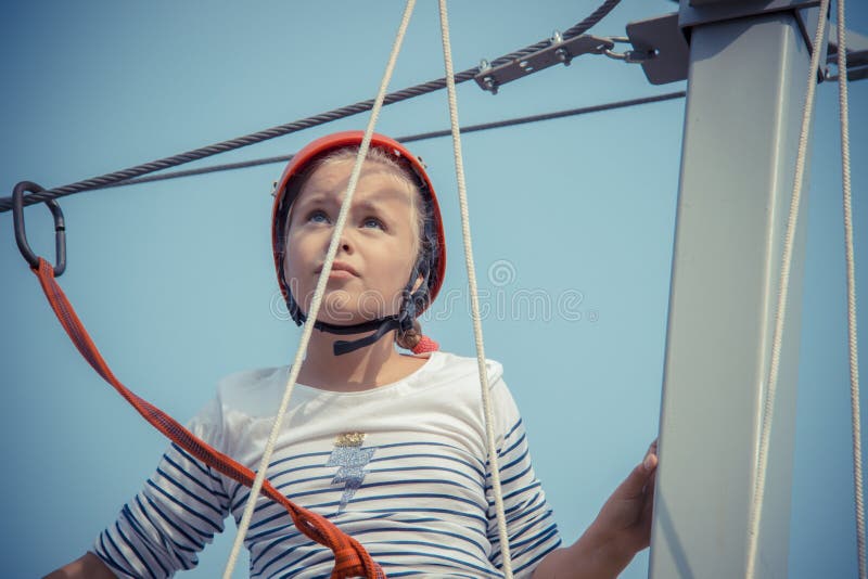 Little Girl Climbing on an Outdoor Ropes Course. Stock Photo - Image of ...