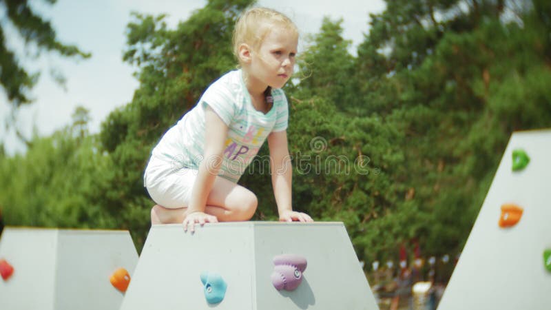 Little Girl Climbing a Rock Wall Indoor Stock Image - Image of exercise ...