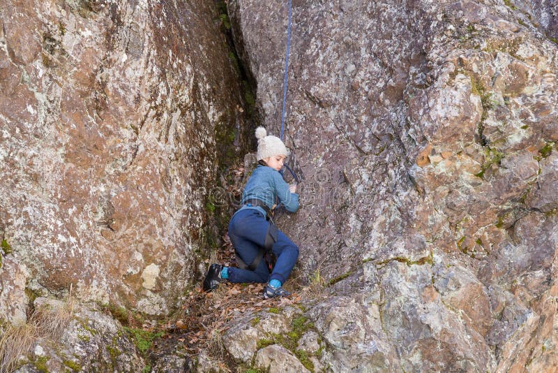 Little Girl Climbing The Vertical Natural Rock Stock Photo - Image of ...