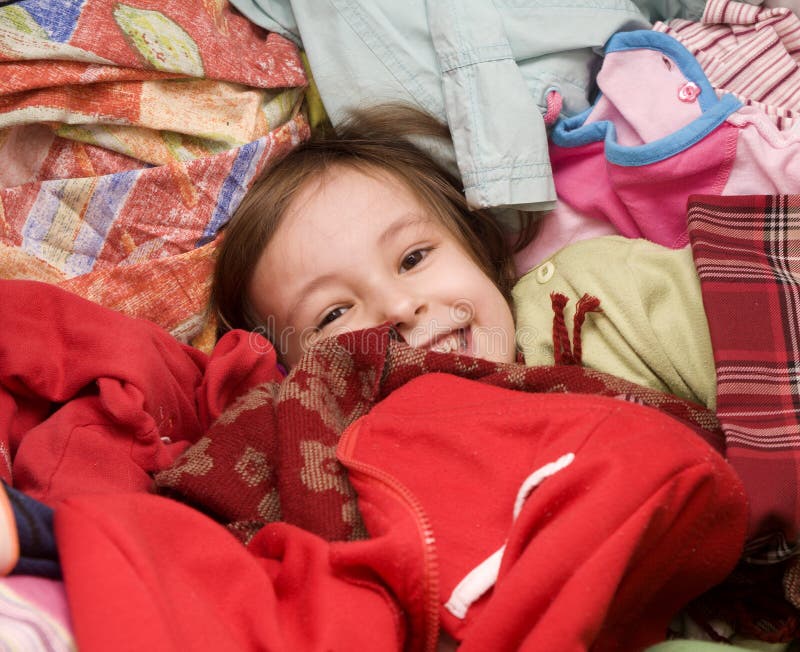 Little girl in clothes stock photo. Image of face, rest - 12867274