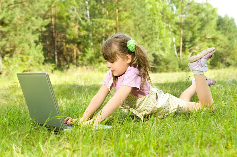 Little girl with computer stock photo. Image of child - 10389416