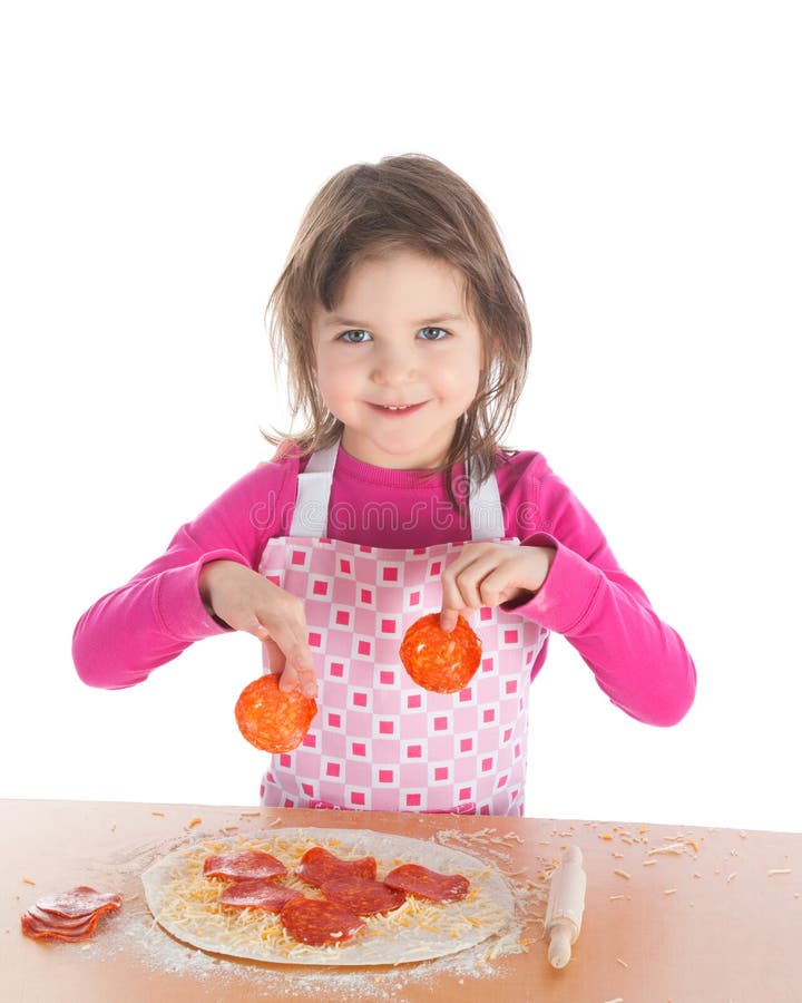 Little girl cooking pizza stock image. Image of home - 16963233