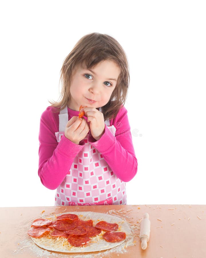 Little girl cooking pizza stock image. Image of home - 16963233