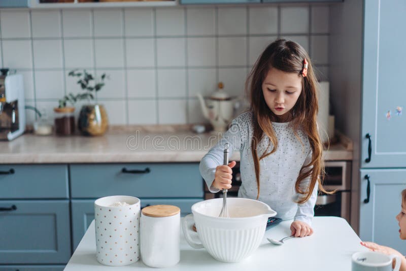 Little Girl Cooks in the Kitchen Stock Image - Image of preparing ...