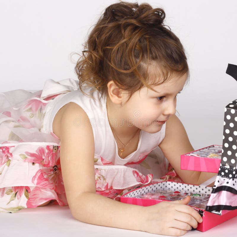 Little girl with cosmetics stock photo. Image of happy - 17377182