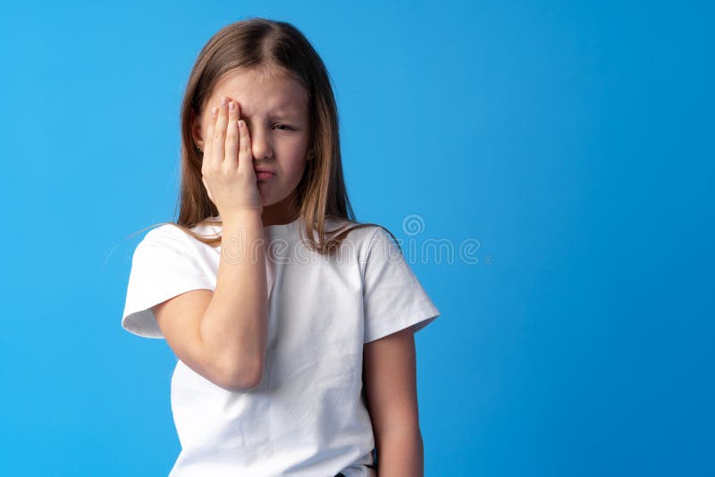 Little Girl Crying Over Blue Background in Studio. Stock Image - Image ...