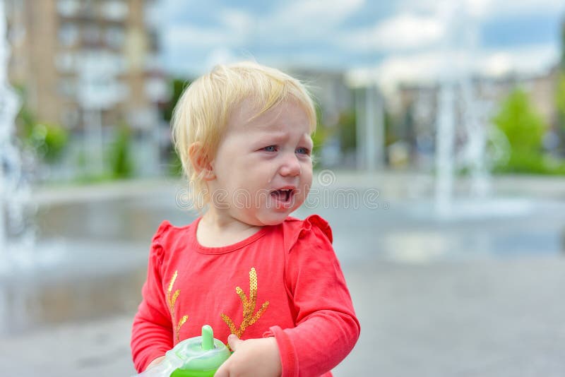 A Little Girl is Crying with Tears Alone in the Park Stock Image ...