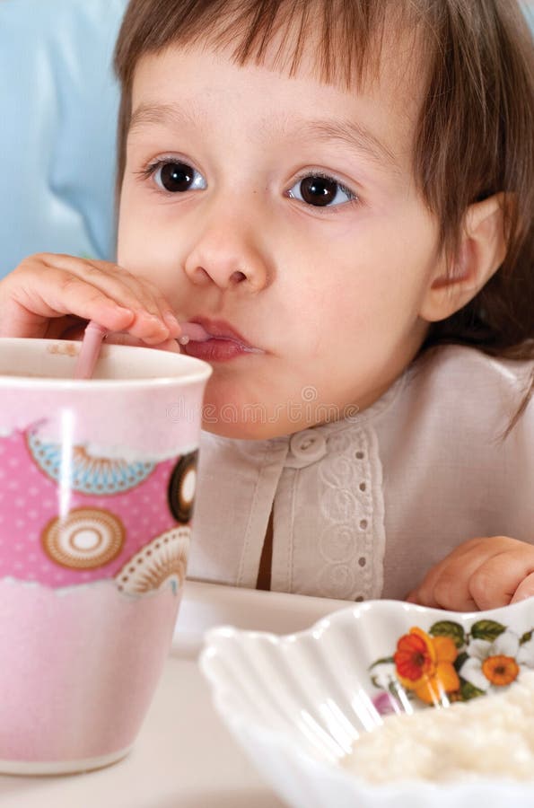 Little girl with cup stock image. Image of breakfast - 22828701