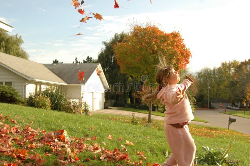 A Little Girl Dancing through Fall Leaves Stock Image - Image of small ...