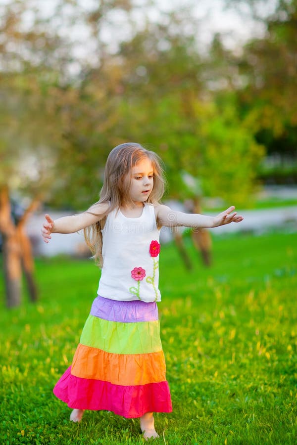 Little Girl Dancing in the Park Stock Photo - Image of hair, people ...