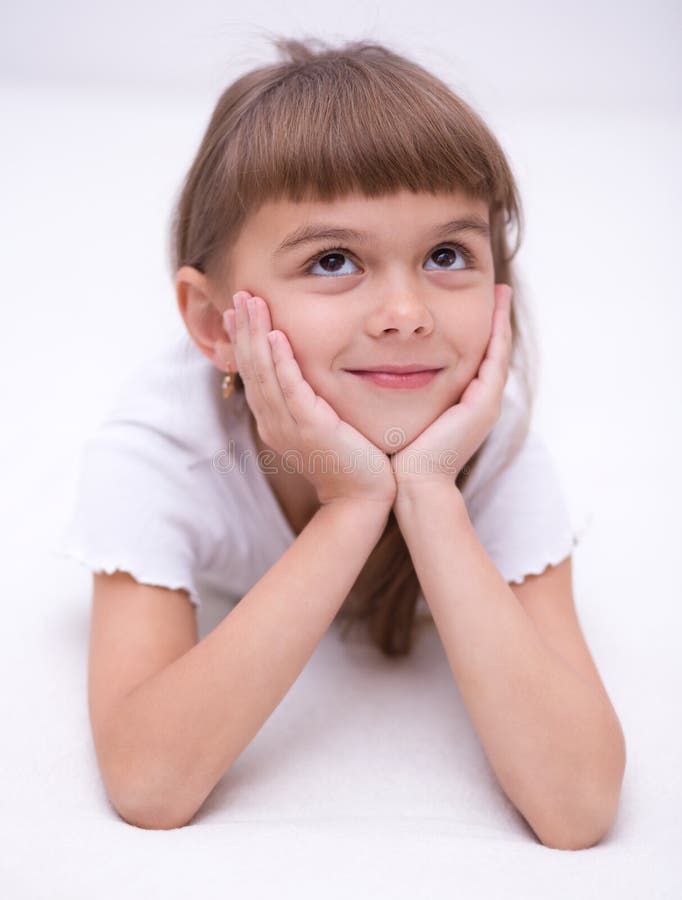 Little girl is daydreaming stock image. Image of face - 36871379