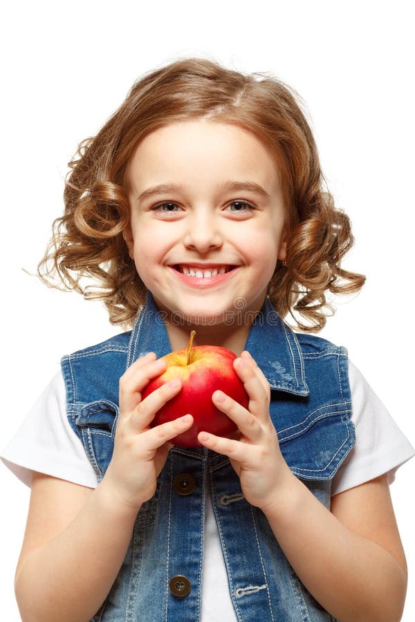 Little Girl in a Denim Jacket Holding a Red Apple. Stock Image - Image ...
