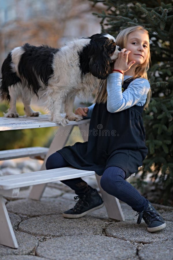 Little girl with dog stock image. Image of little, playing - 143756415
