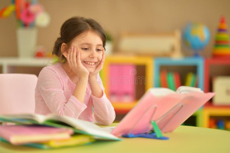 Little Girl Doing Homework at the Table at Home Stock Photo - Image of ...
