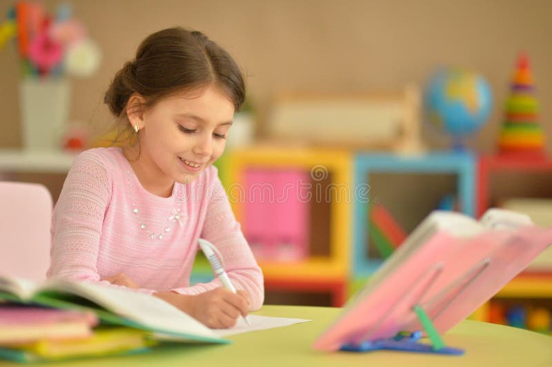 Little Girl Doing Homework at the Table at Home Stock Image - Image of ...