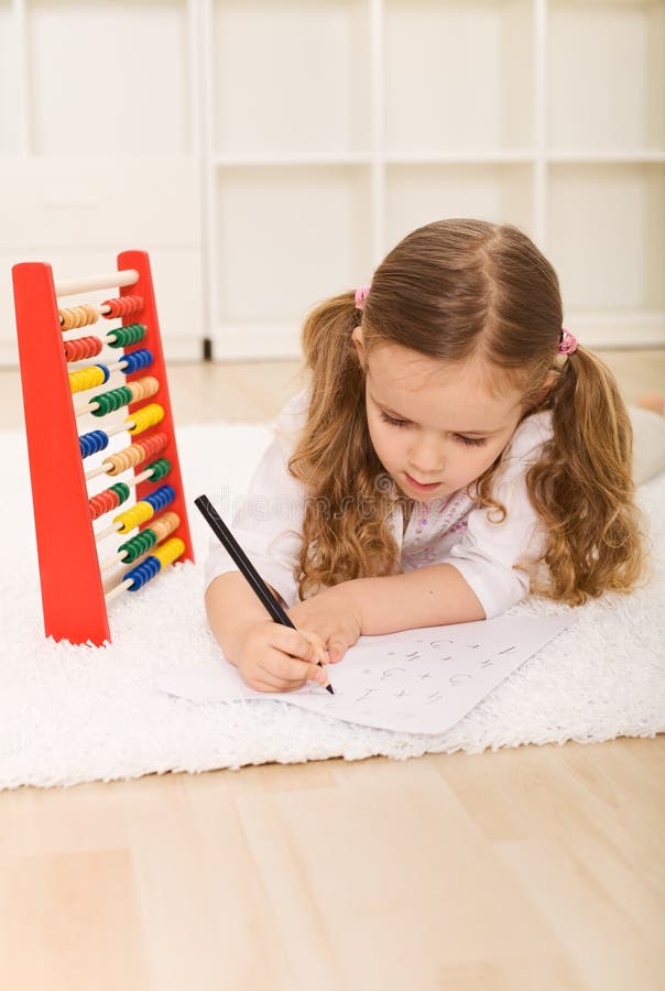 Kid doing math exercise stock image. Image of young, science - 18984023