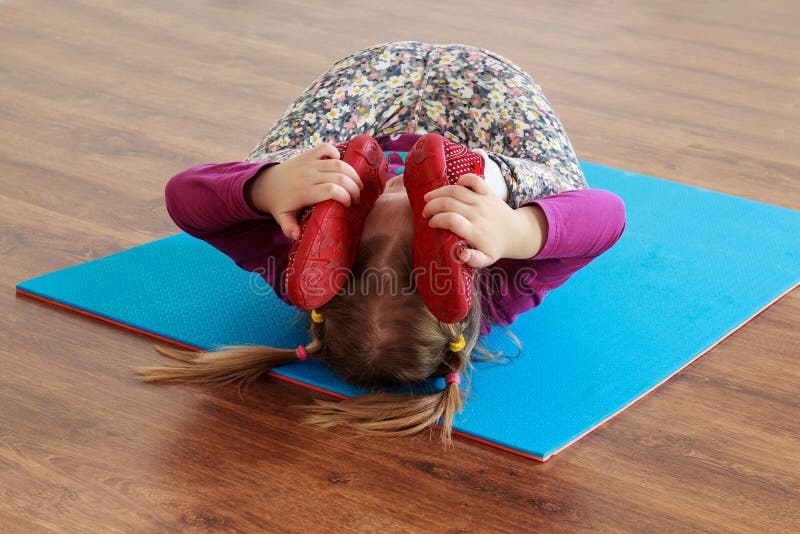 Little Girl is Doing Stretching Workout on a Mat. Stock Image - Image ...