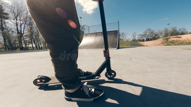 Little Girl Doing Tricks by Kick Scooter in a Park Stock Video - Video ...
