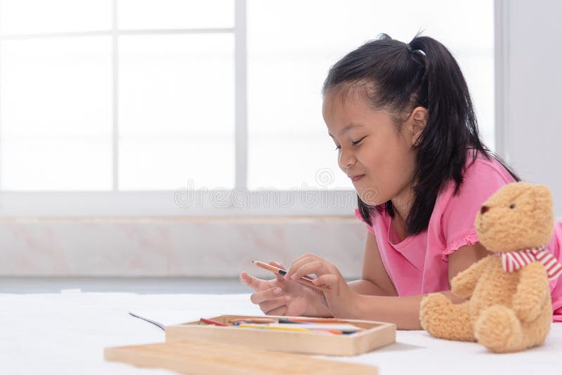Little Girl Drawing at Home. Kids Playing Alone at Home Stock Photo ...