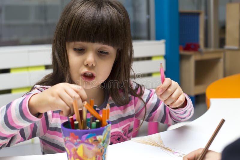 Little girl drawing stock photo. Image of youth, playful - 65789636