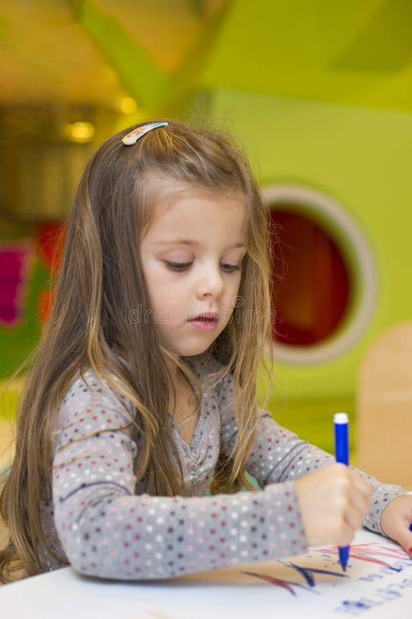 Little Girl Drawing at Playroom Stock Image - Image of playroom ...