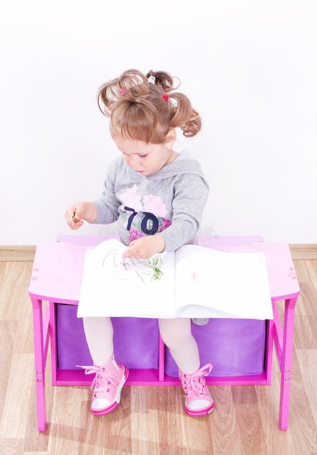 Little girl draws stock photo. Image of color, white - 51891792
