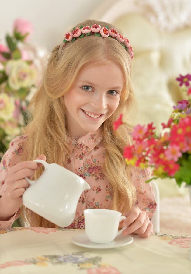Little girl drinking tea stock image. Image of leisure - 73917493