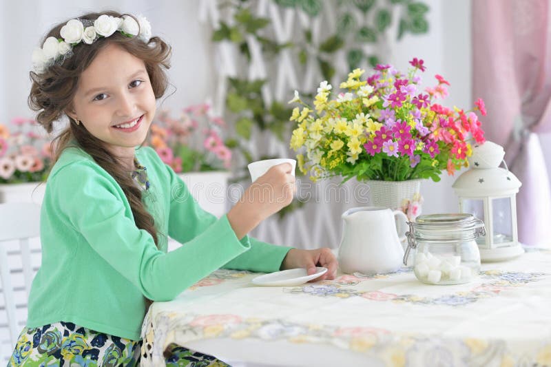 Little girl drinking tea stock photo. Image of little - 83227078