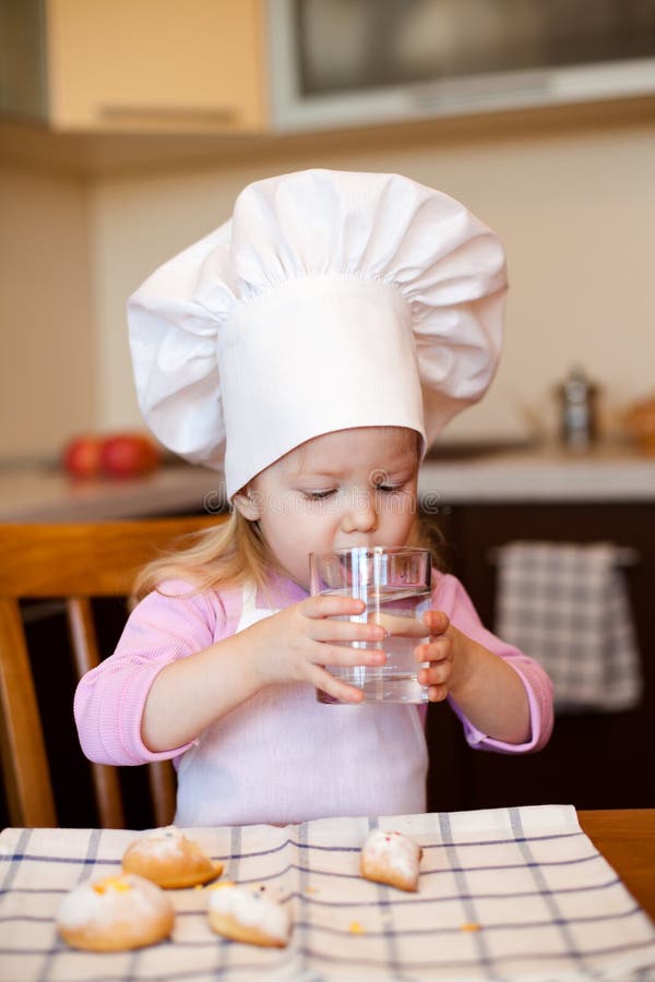 Little Girl Drinks Water on Kitchen Using Glass Stock Image - Image of ...