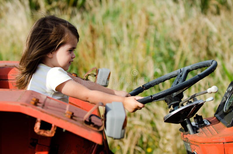 Small Child Sitting on an Old Tractor Stock Photo - Image of farming ...