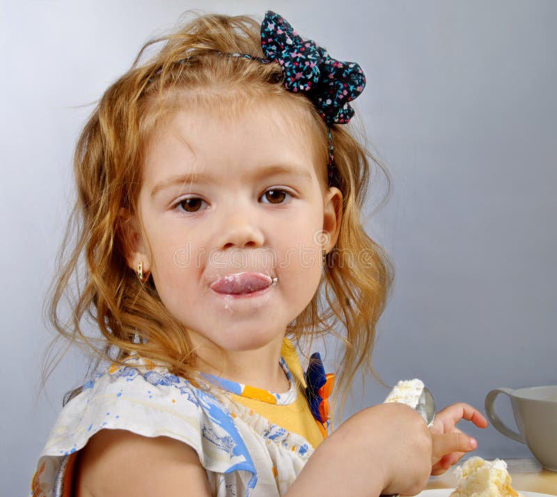 Little girl eating stock image. Image of positive, face - 19663563