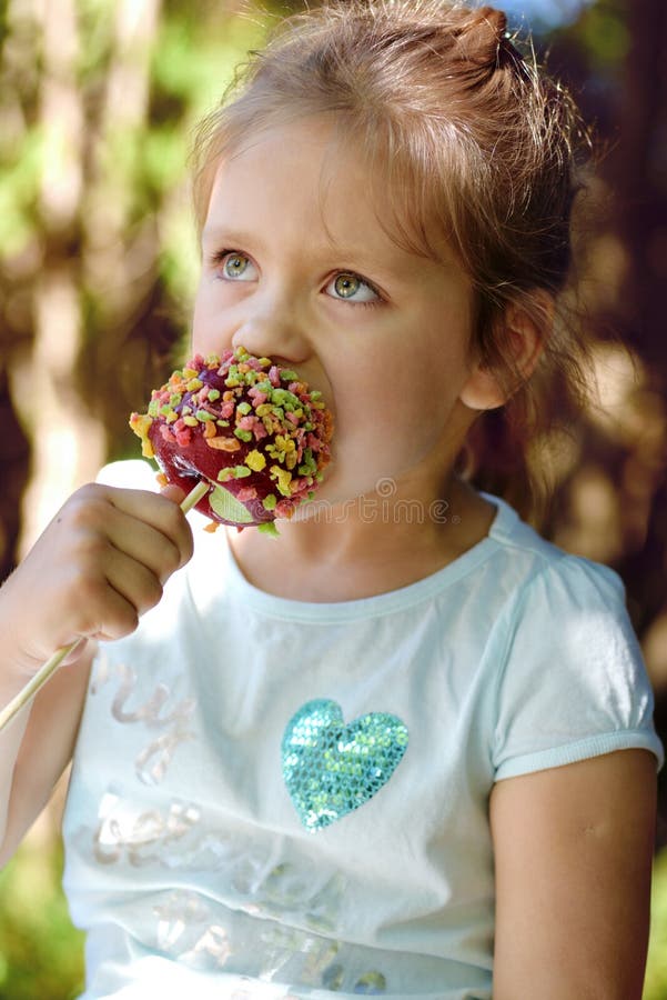 109 Eating Candy Apple Fair Stock Photos - Free & Royalty-Free Stock ...