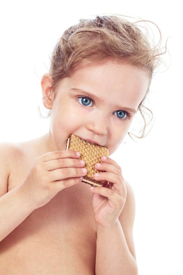 Little Girl Eating a Cookie Stock Image - Image of beautiful, blue ...