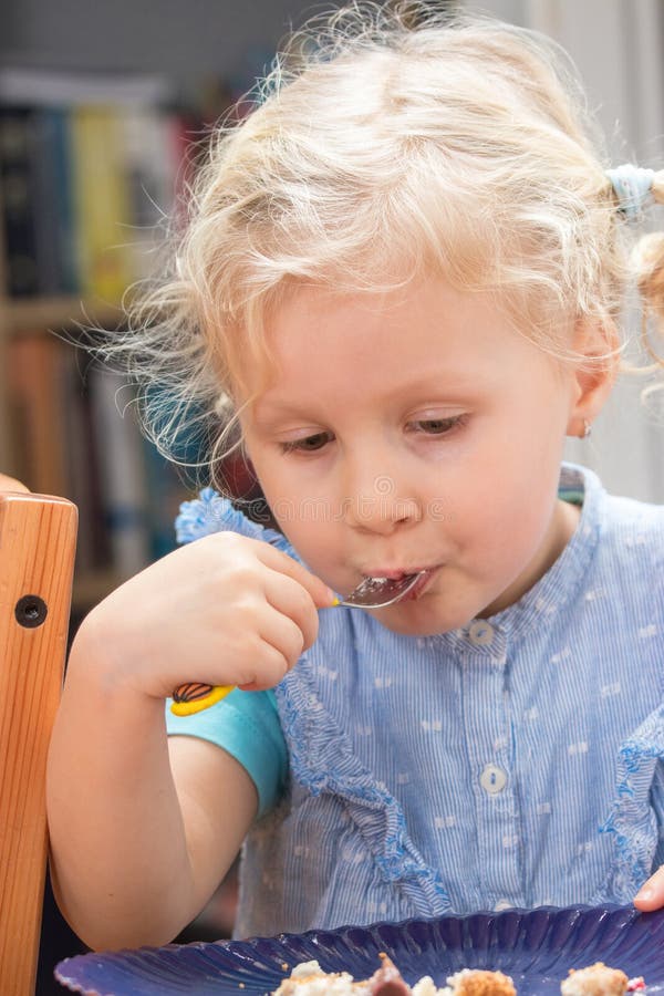 Little girl eating dessert stock image. Image of facial - 107759493