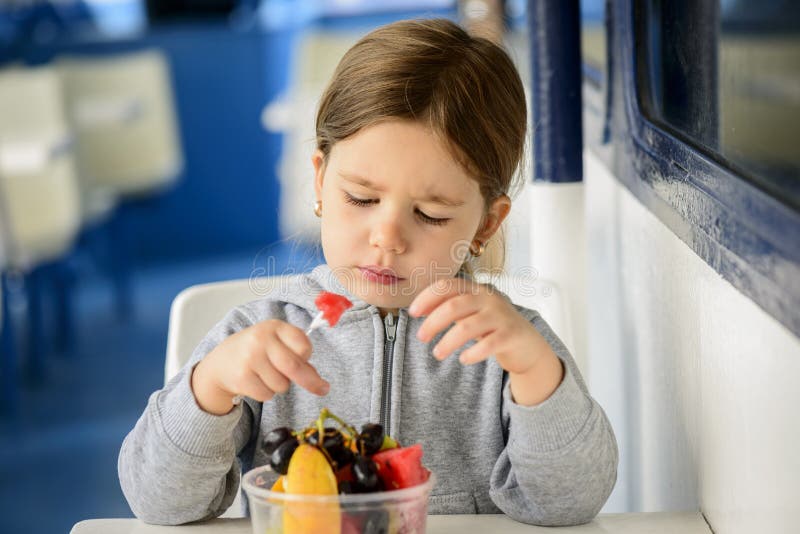 Little Girl Eating Healthy Snack Stock Photo - Image of holding, juicy ...