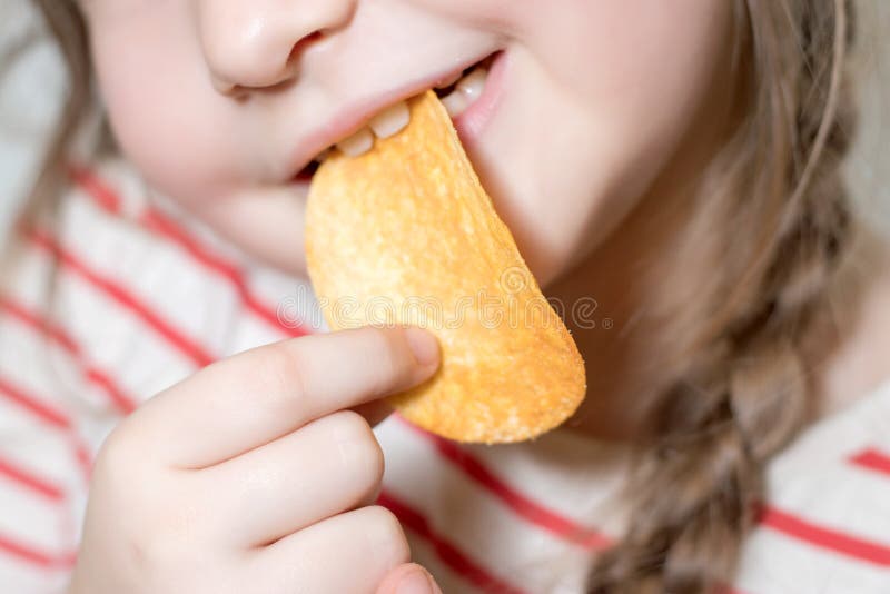 Little Girl Eating A Potato Chips Stock Image - Image of eating, fries ...