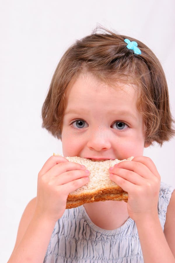Little Girl Eating Sandwich Stock Photo - Image of pretty, people: 1103304