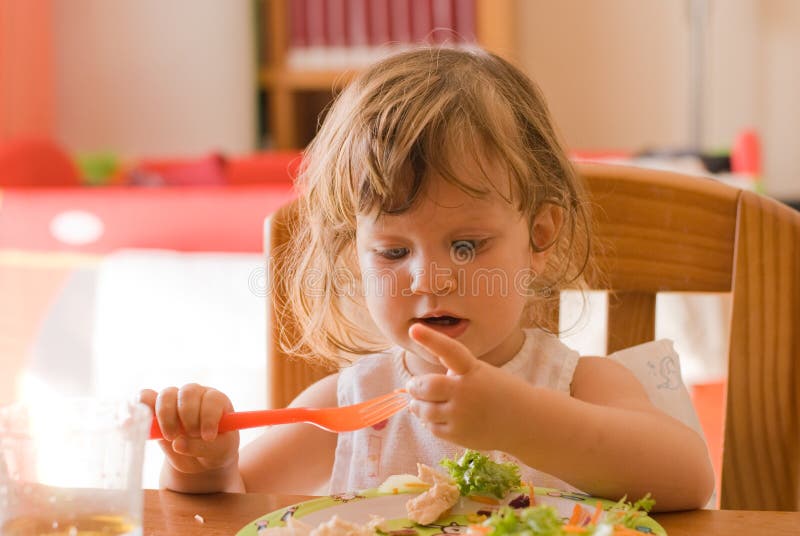 The little girl eating stock image. Image of babies, nature - 78321827