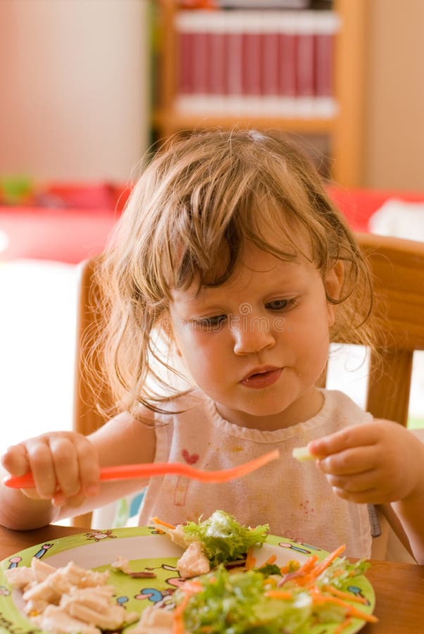 The little girl eating stock photo. Image of life, food - 78330788
