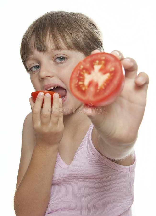Little Girl Eating a Tomato Stock Image - Image of cute, juicy: 26136755