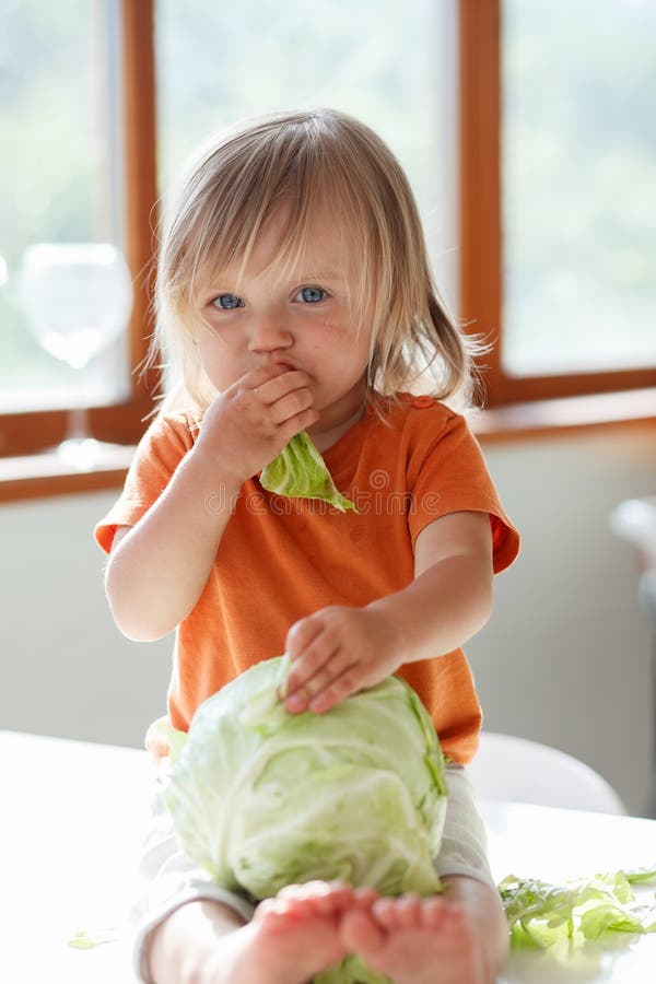 Little girl eats cabbage stock photo. Image of fresh - 32098266
