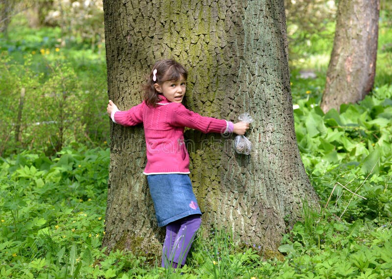 Little Girl Embraces Trunk Big Tree Stock Photos - Free & Royalty-Free ...