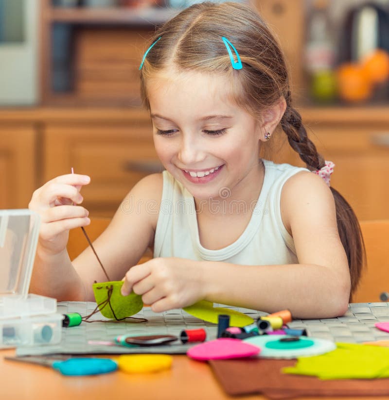 Little Girl is Engaged in Needlework Stock Photo - Image of happiness ...