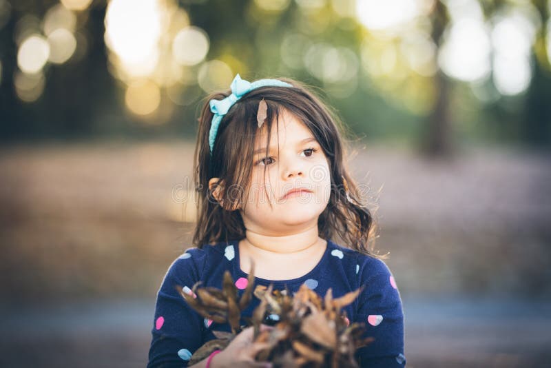 Little girl enjoying fall stock image. Image of activity - 156269461