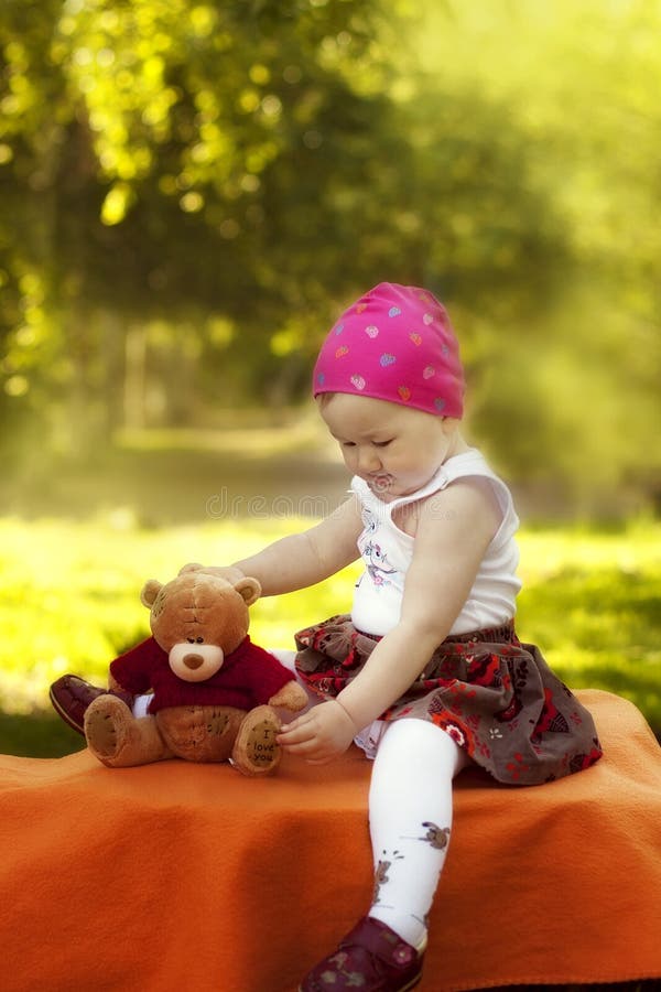 Little Girl Enjoys Playing with Teddy Bear Stock Image - Image of ...