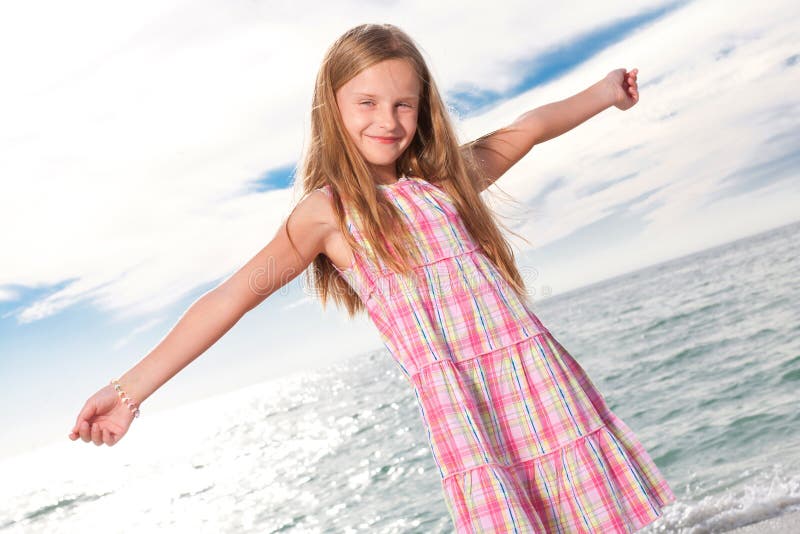 Little Girl Enjoys Summer Day at the Beach. Stock Image - Image of ...