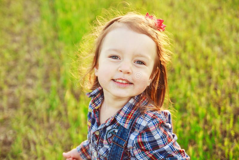 Little girl in the field stock photo. Image of caucasian - 55555654