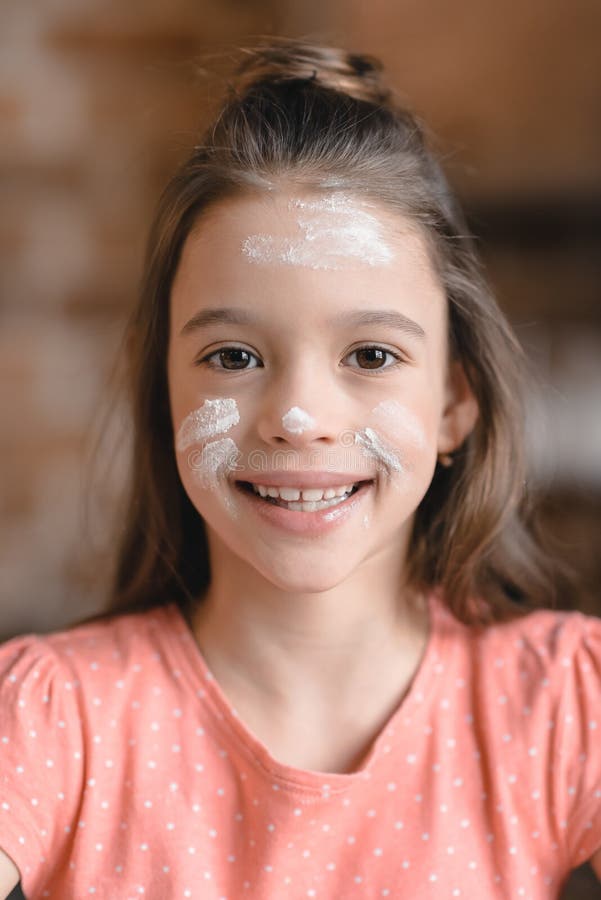 Little Girl with Flour on Face Smiling at Camera Stock Photo - Image of ...